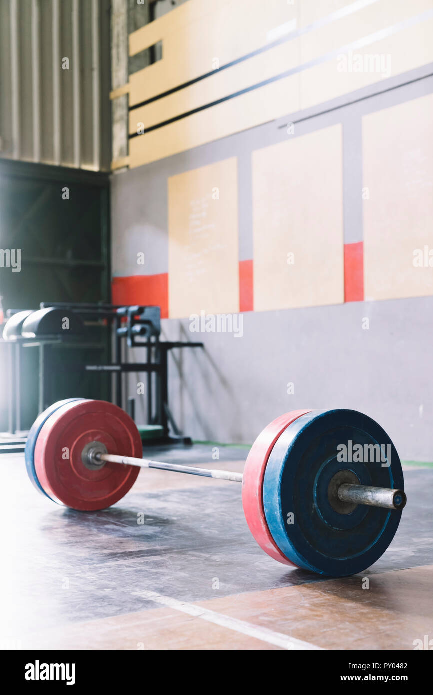 Bodybuilding concept with barbell in gym Stock Photo - Alamy