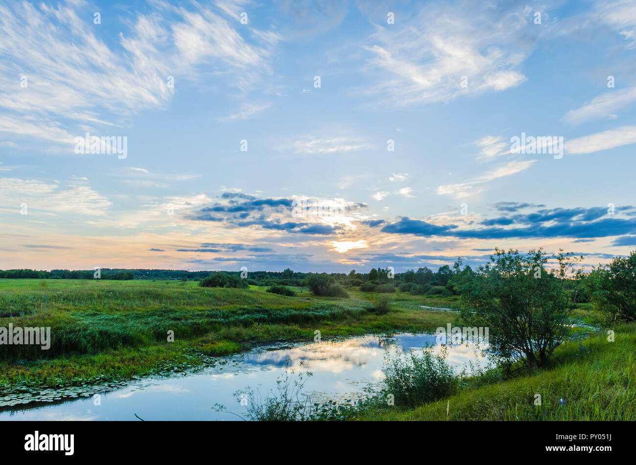 Yellow-red glow in the picturesque sunset sky. Colorful evening ...