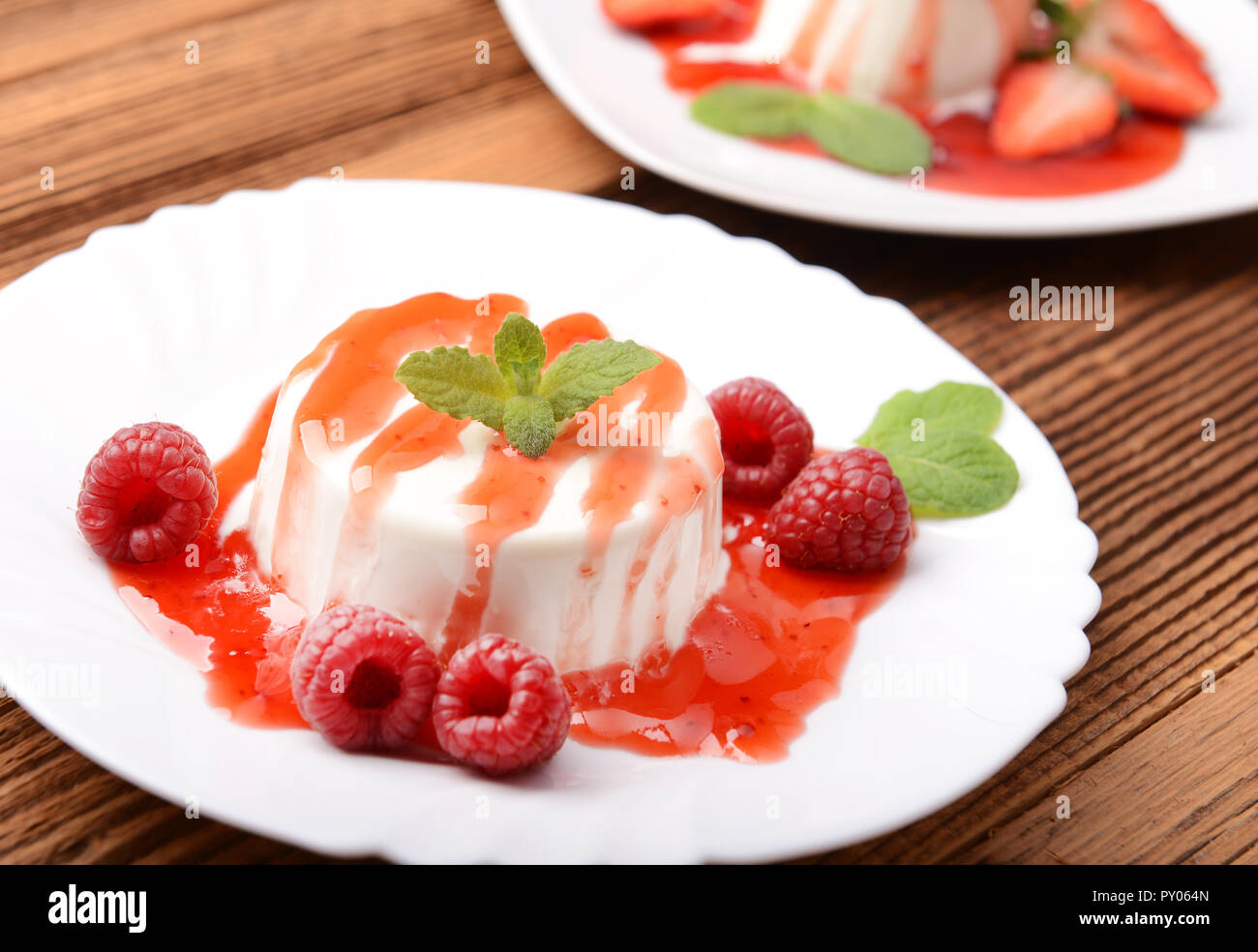 Italian dessert panna cotta with raspberries Stock Photo - Alamy