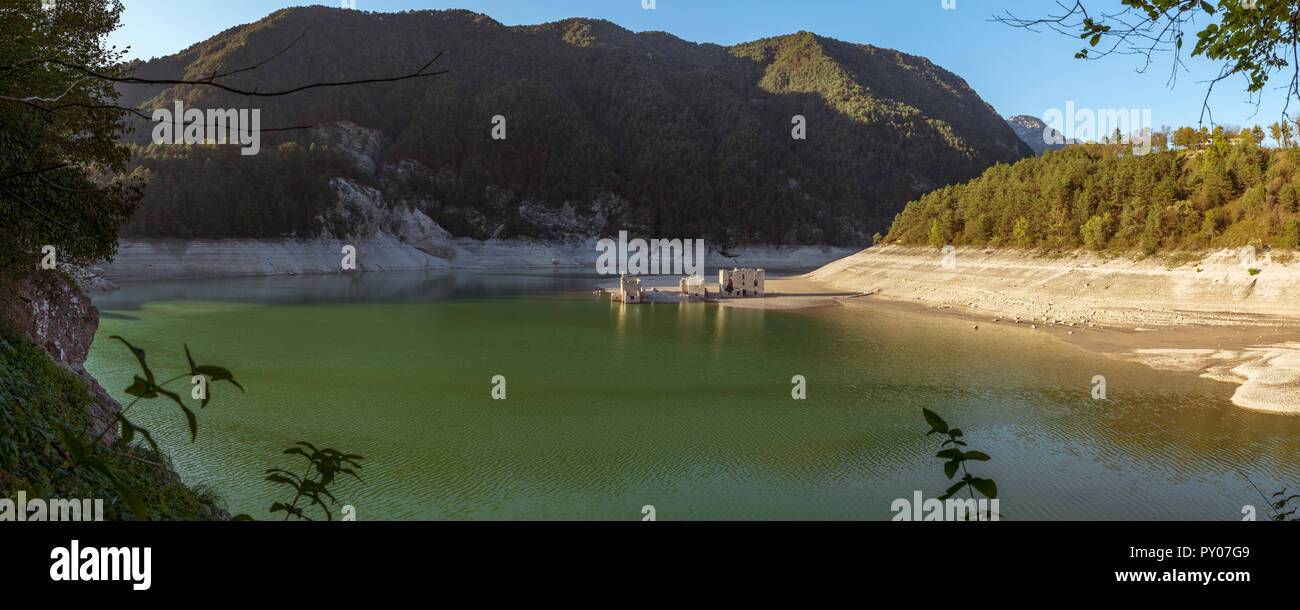 Large panorama of Redona artificial lake with abandoned building on the ...