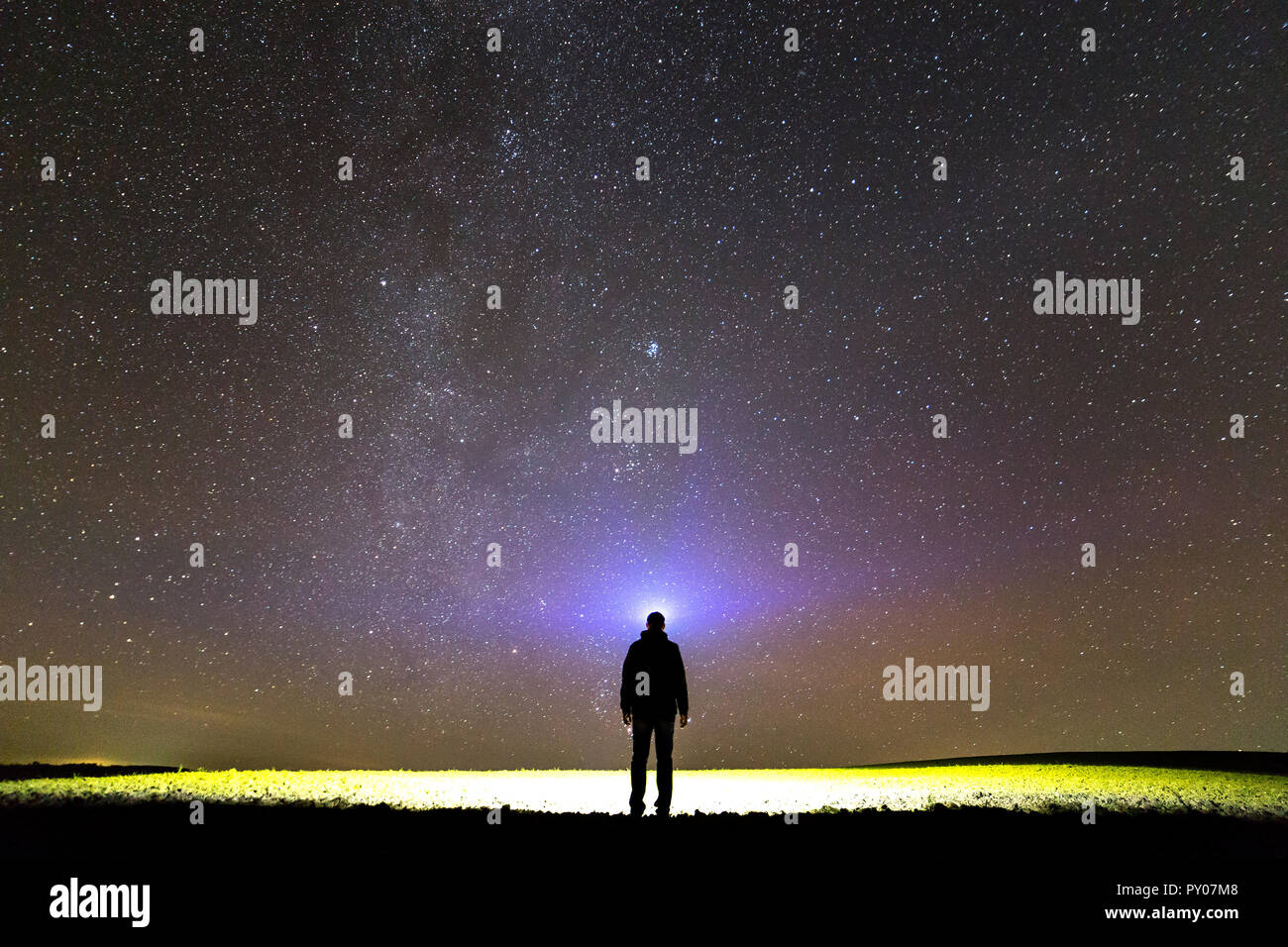 Man standing under stars at night hi-res stock photography and images ...