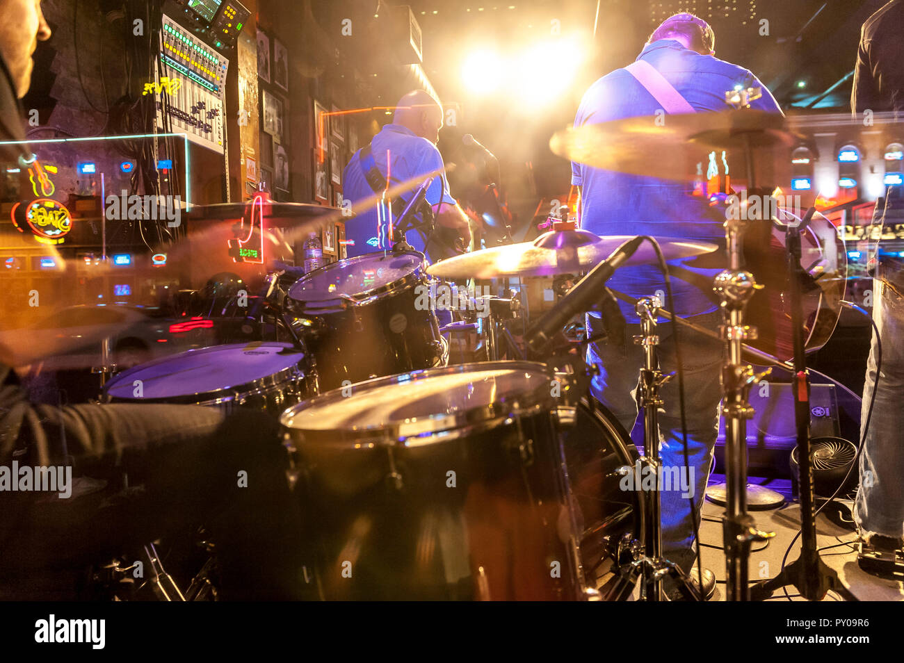 View through window of band performing in club on Broadway at night ...