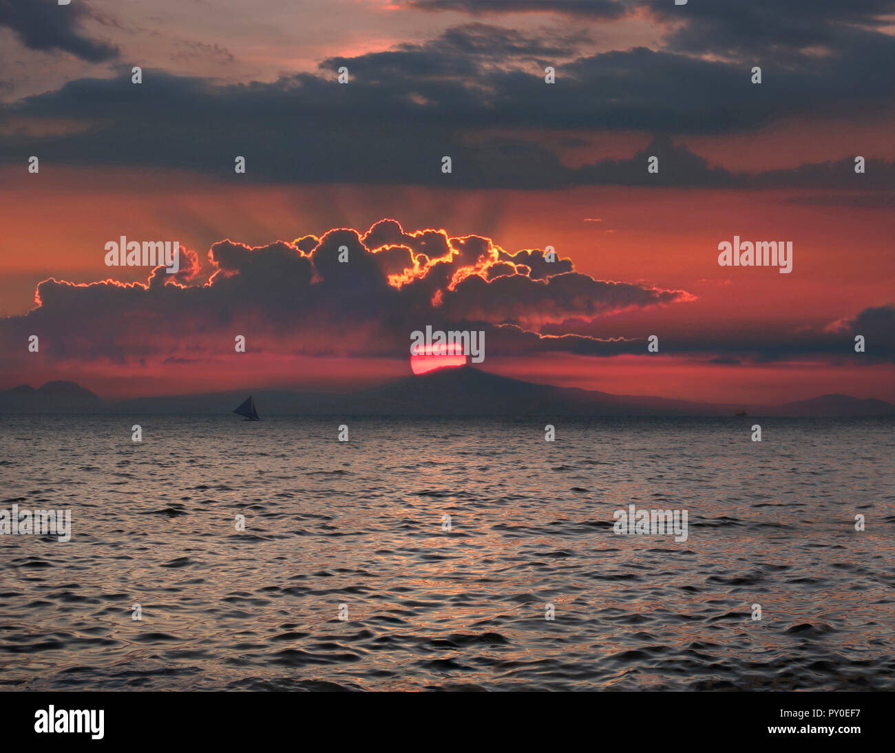 Distant view of silhouette of sailboat in sea at sunset, Boracay, Aklan ...