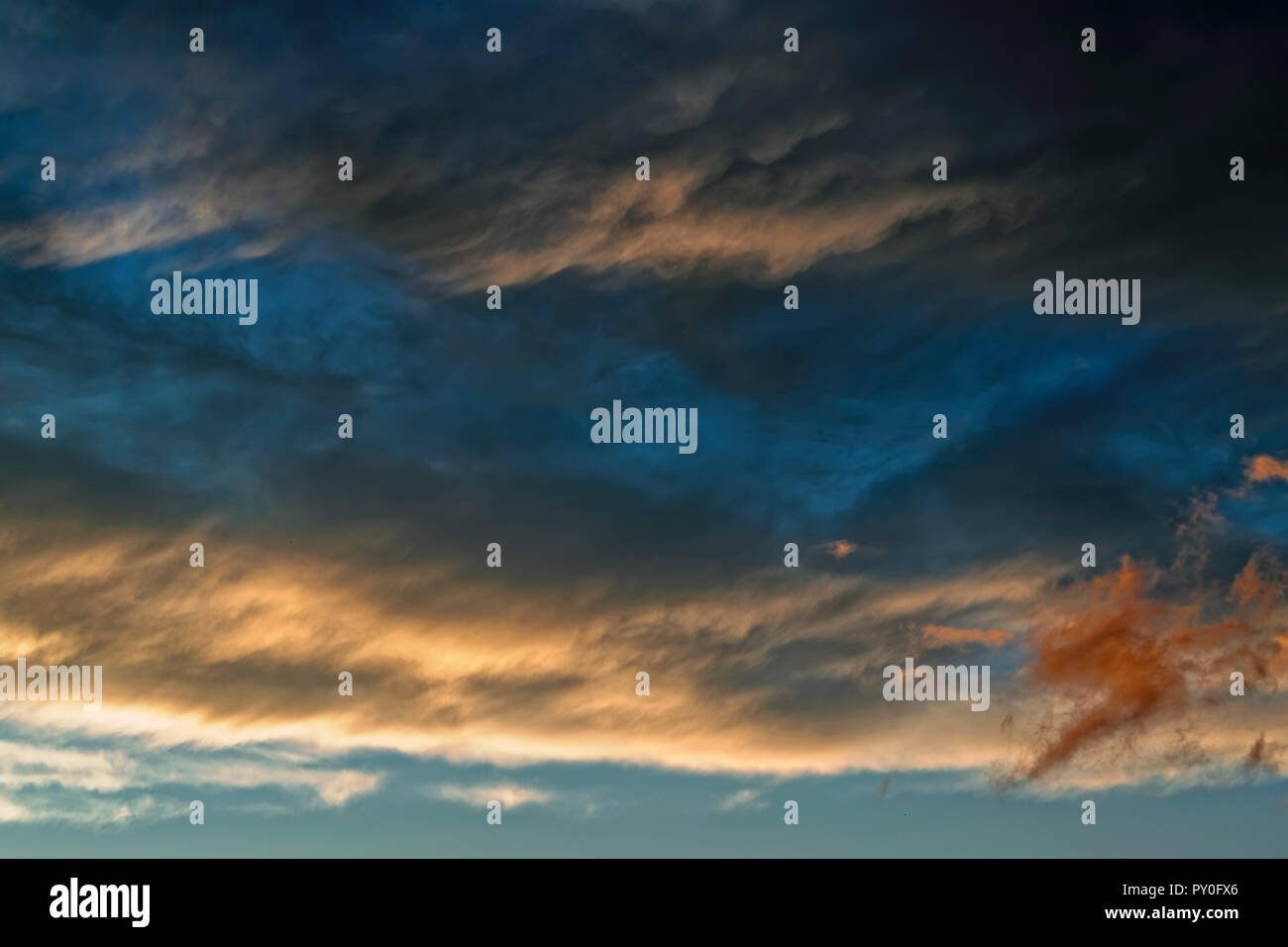 Dramatic evening sky with beautiful clouds illuminated by the setting sun Stock Photo - Alamy