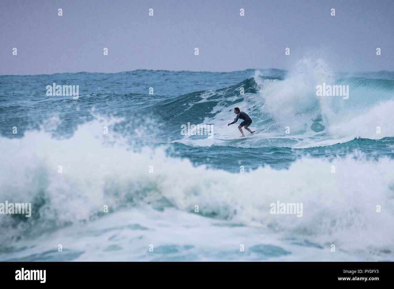 Man surfing on messy waves on north shore of oahu hi-res stock ...
