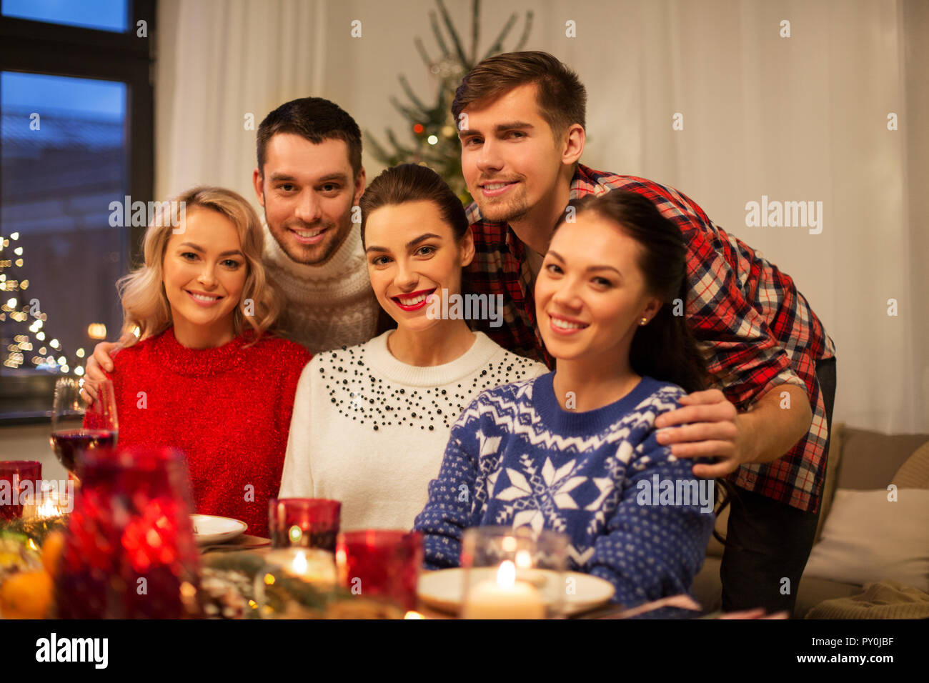 Celebrating christmas happy friends hi-res stock photography and images ...
