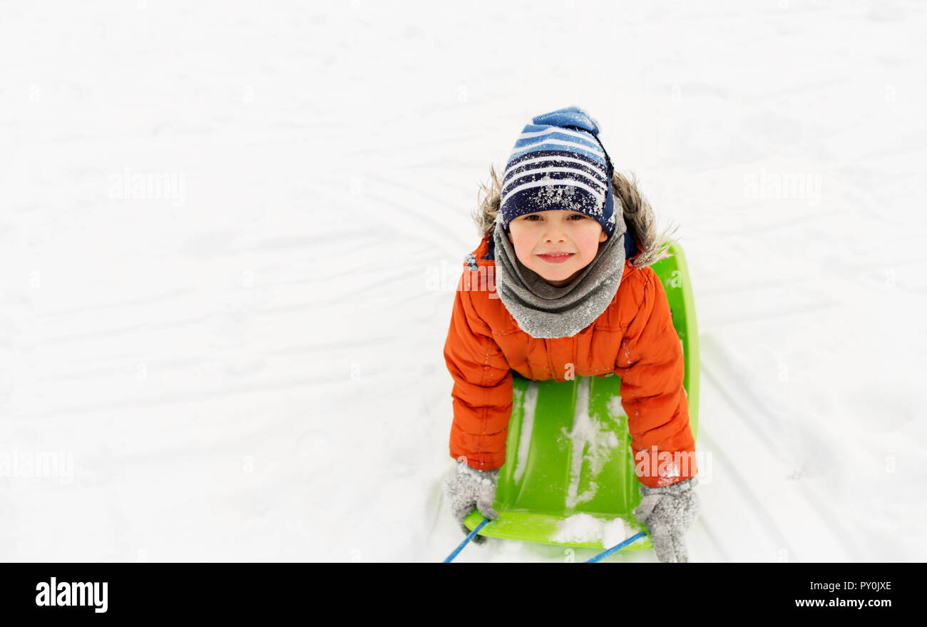 Boy sled riding hi-res stock photography and images - Alamy
