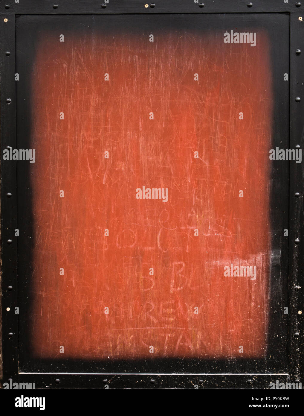 black metal frame around a blank red panel used in restaurant to write ...