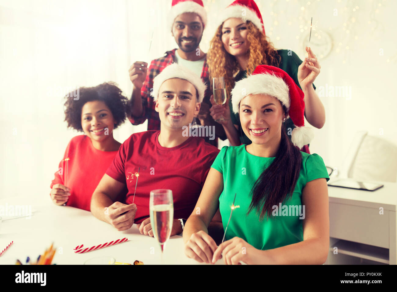 happy team celebrating christmas at office party Stock Photo - Alamy