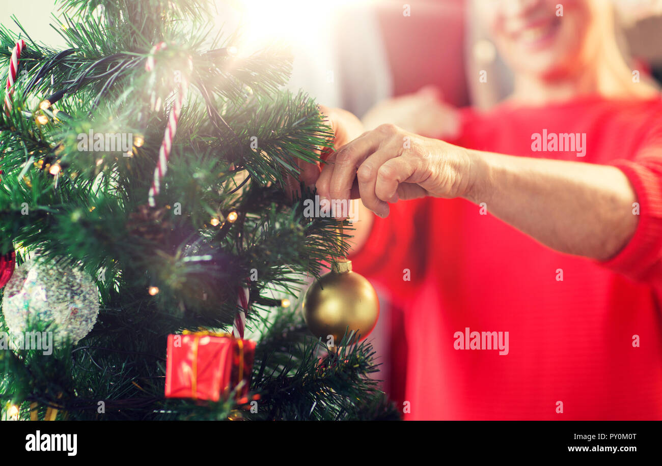 Hand woman decorating tree hi-res stock photography and images - Alamy