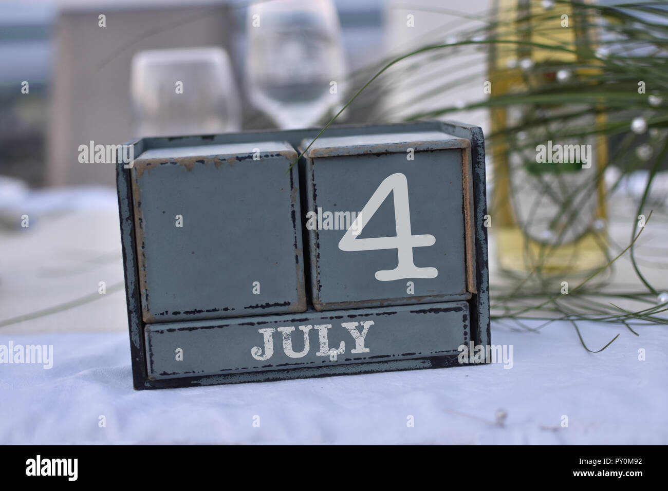 Wood blocks in box with date, day and month 4 July. Wooden blocks ...