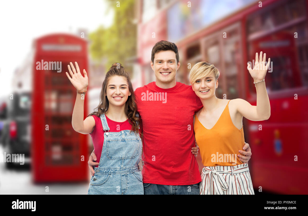 happy friends over london city street background Stock Photo - Alamy