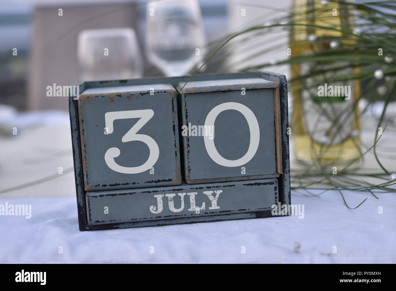 Wood blocks in box with date, day and month 30 July. Wooden blocks ...