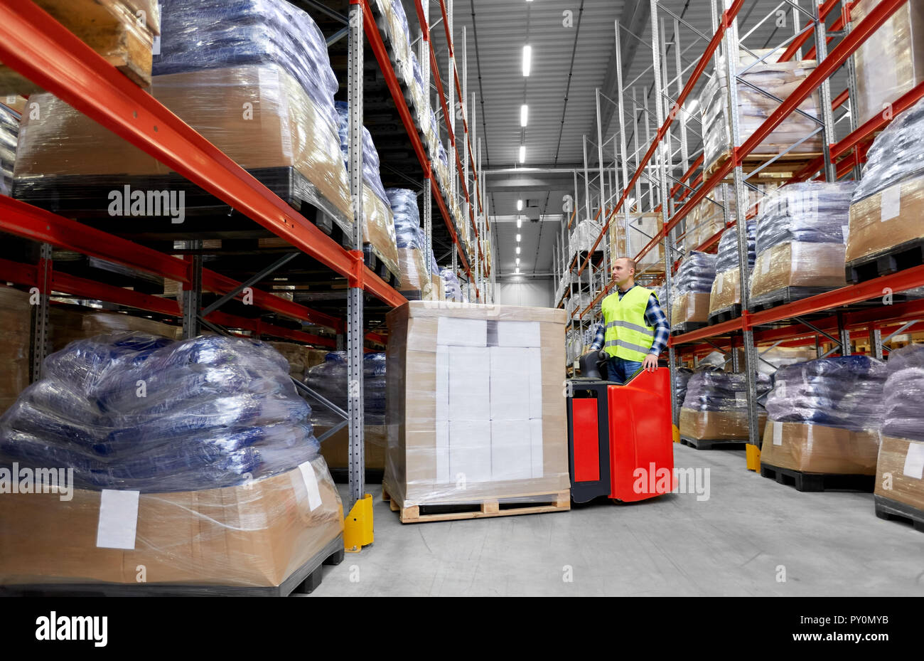 loader operating forklift at warehouse Stock Photo - Alamy