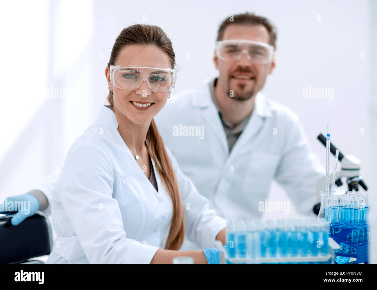 two scientists biologists sitting in a laboratory Stock Photo - Alamy