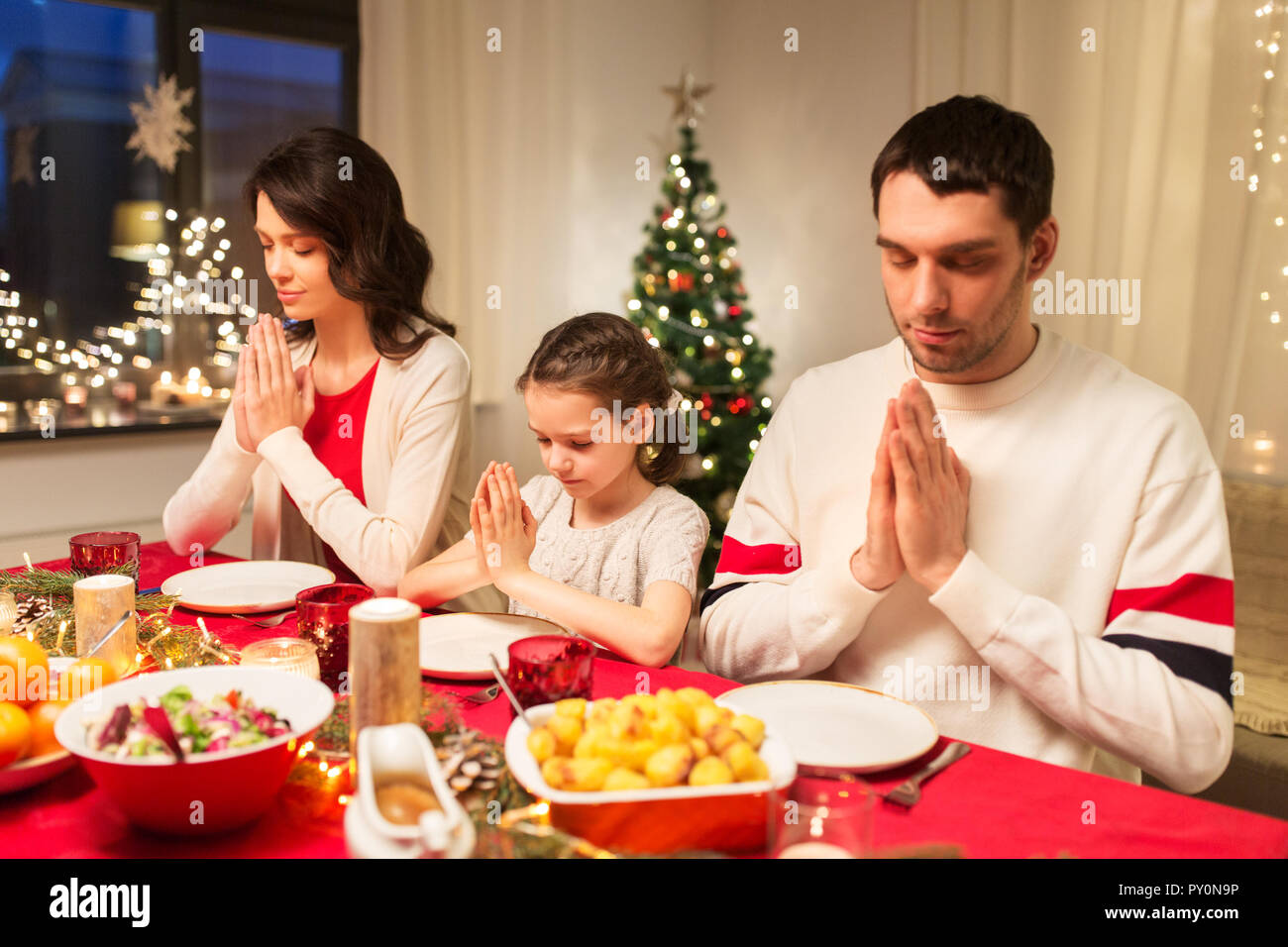 Young christian family praying together hi-res stock photography and ...