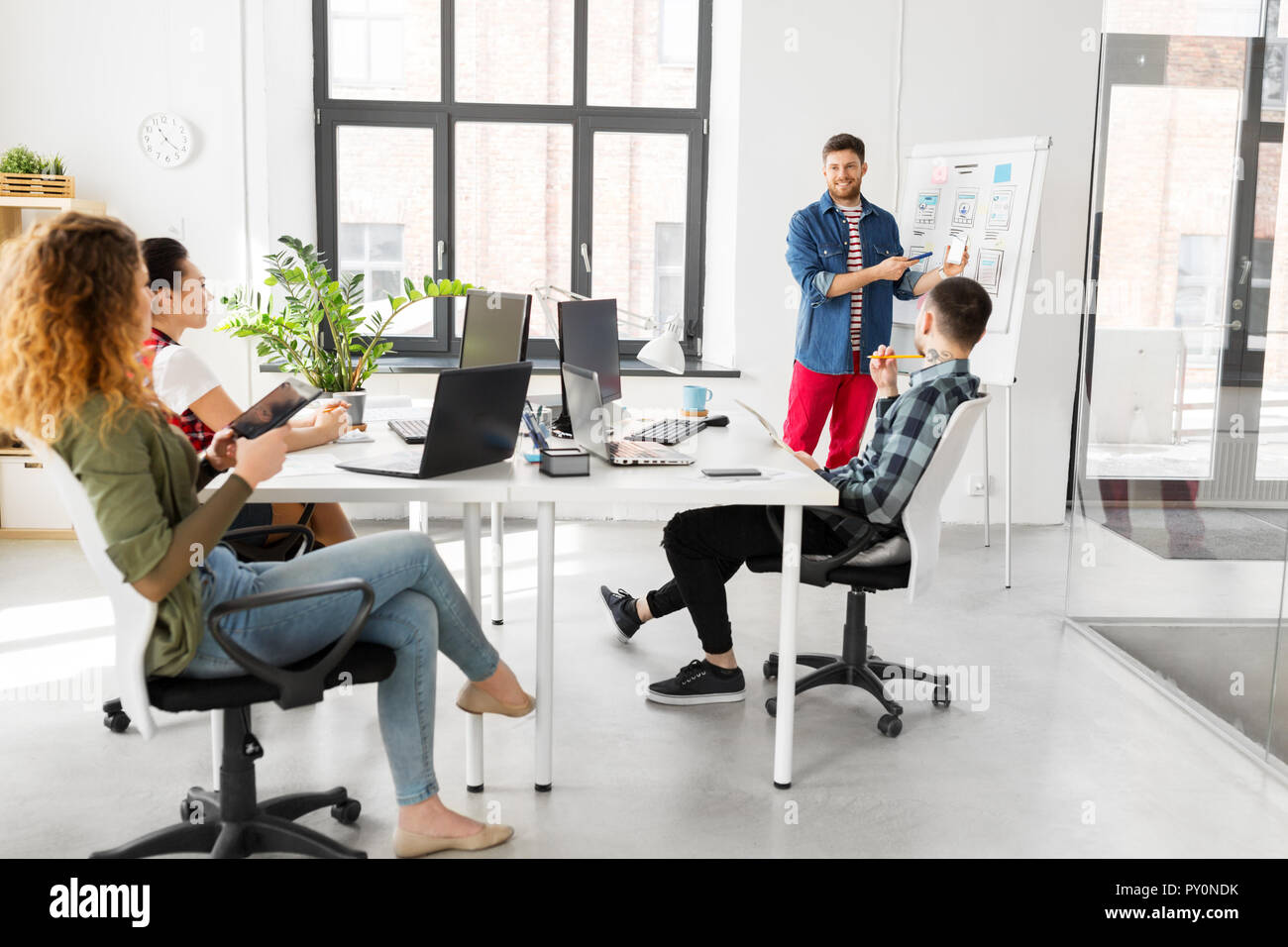 man showing smartphone user interface at office Stock Photo - Alamy