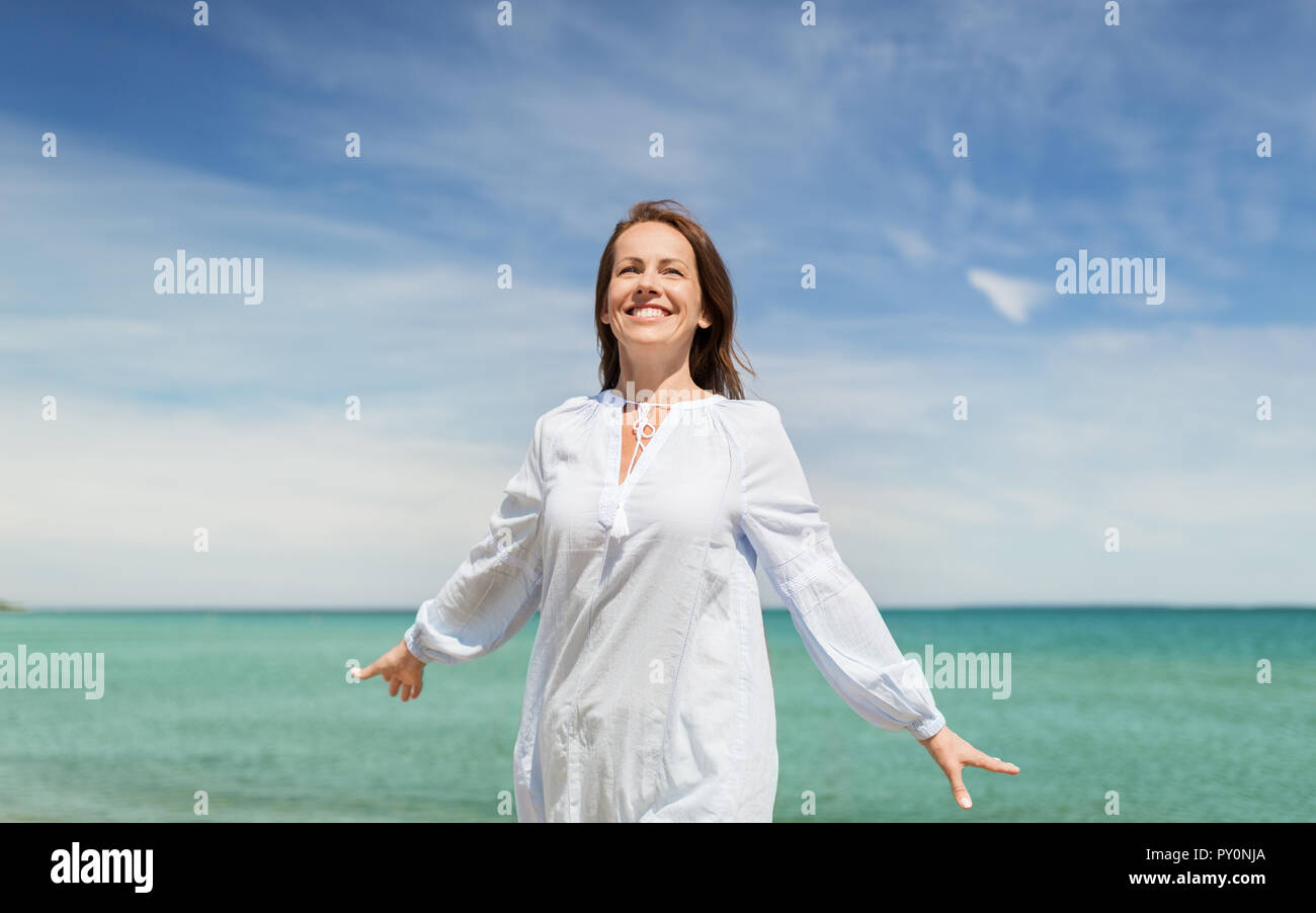 happy smiling woman on summer beach Stock Photo - Alamy