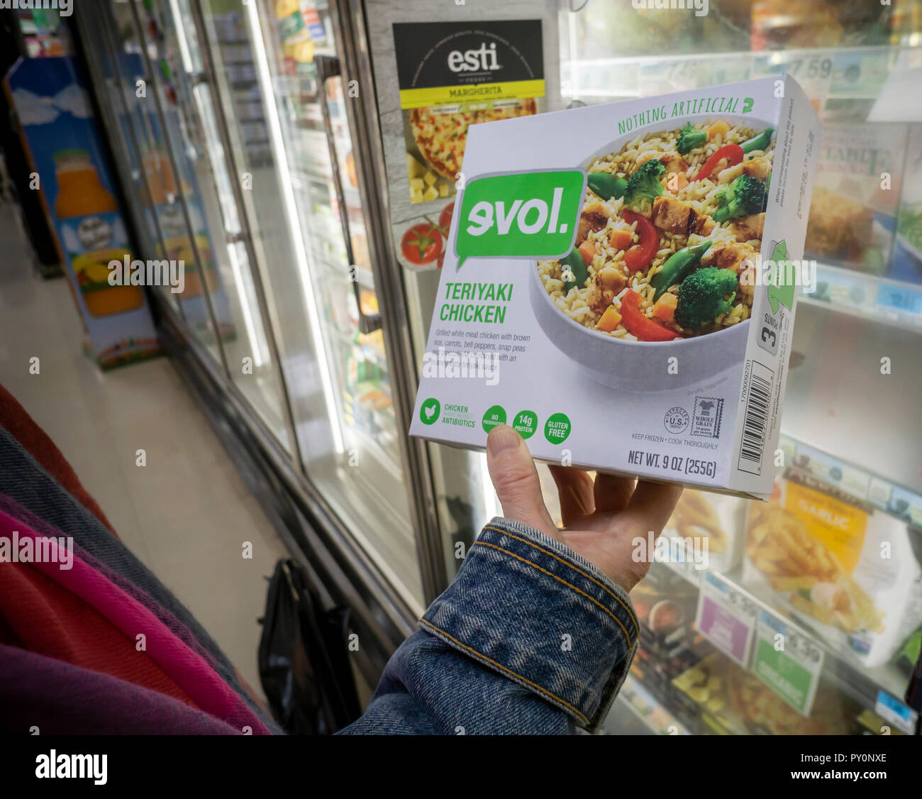 A shopper chooses a package of Pinnacle Foods brand EVOL frozen dinner ...