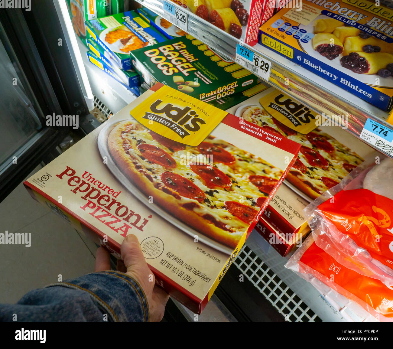 A shopper chooses a package of Pinnacle Foods brand Udi's gluten-free ...