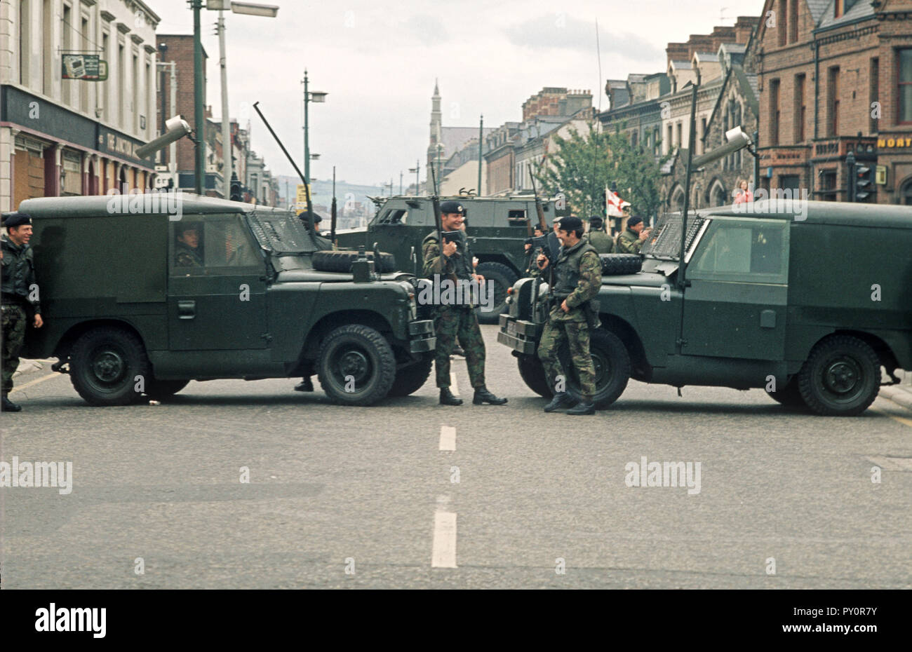 Belfast, 1972: British Army Land Rovers and soldiers blocking road in ...