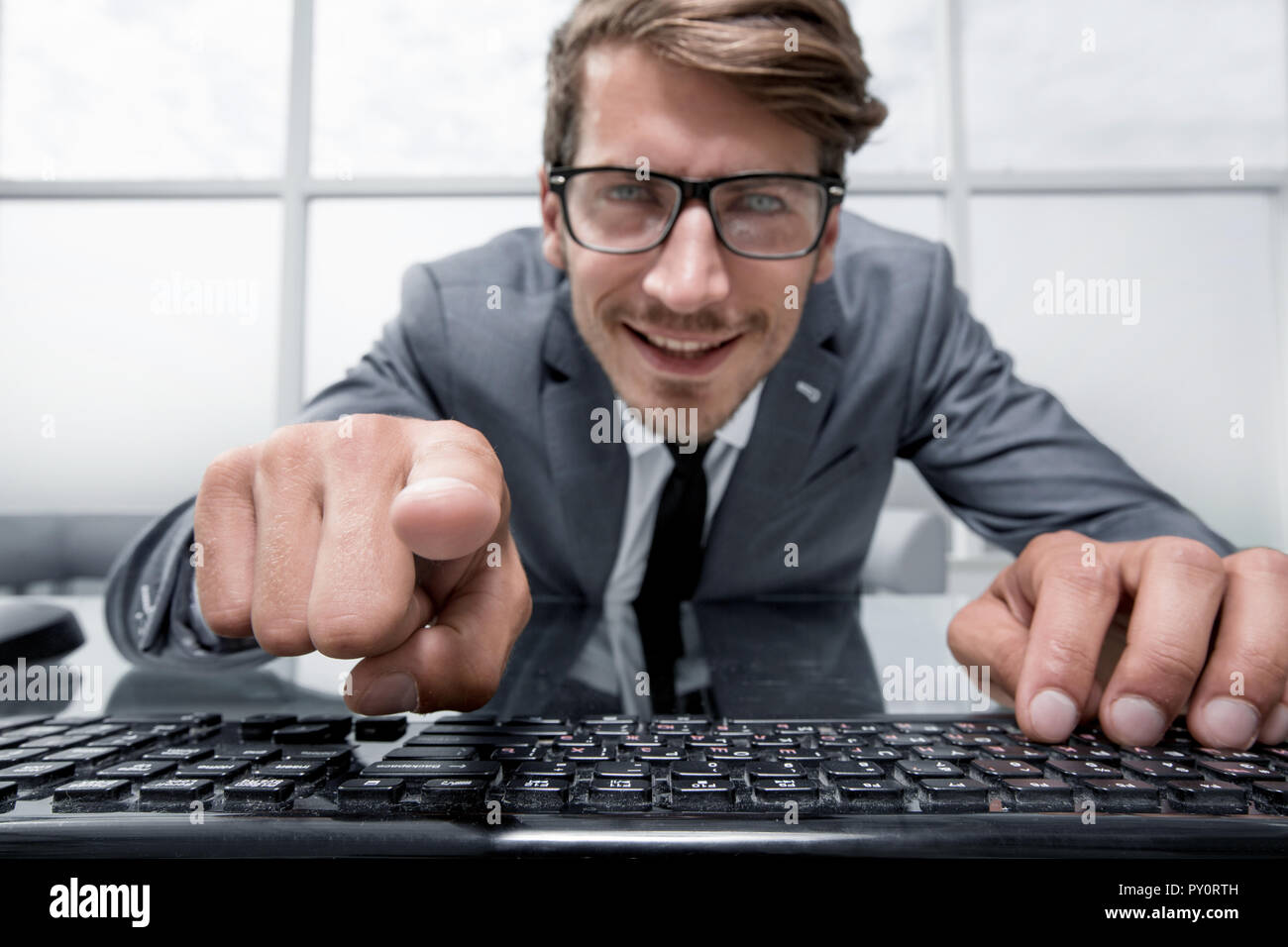 Smiling businessman shows thumb hi-res stock photography and images - Alamy