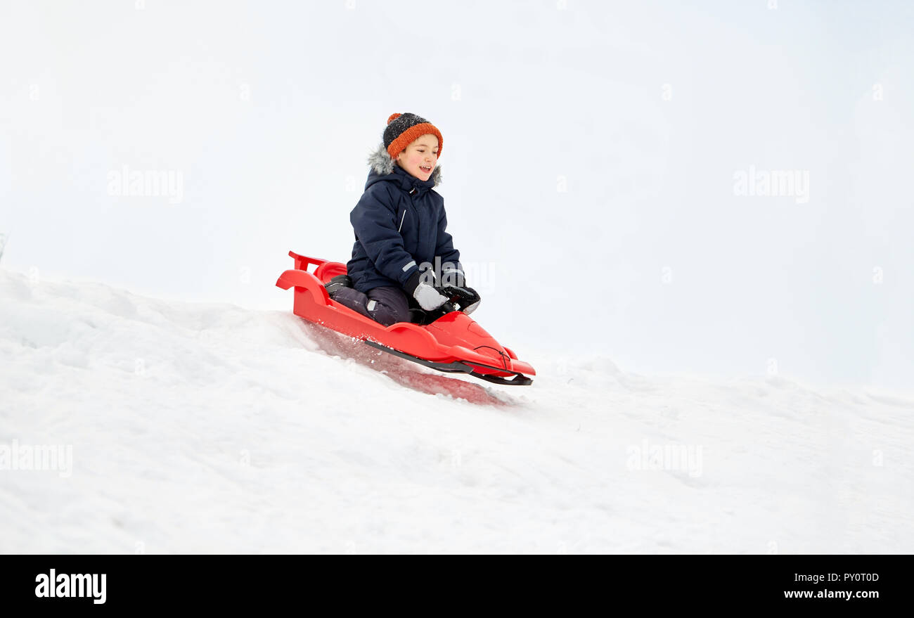Boy sled riding hi-res stock photography and images - Alamy