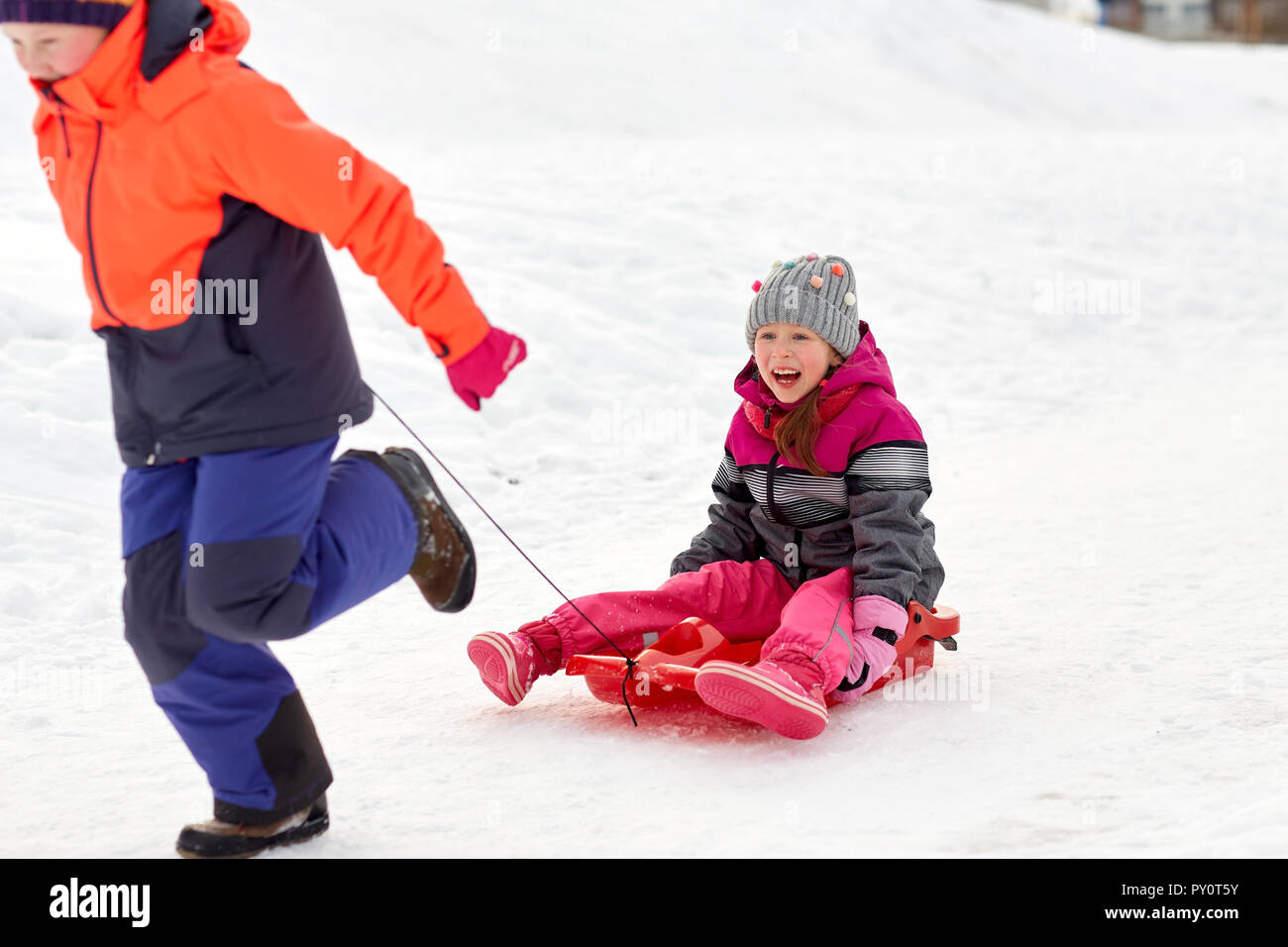 girls with sled having fun outdoors in winter Stock Photo - Alamy
