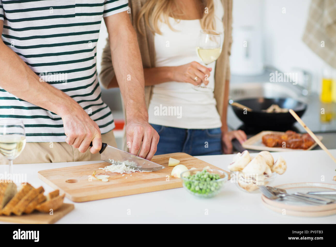 Man cooking woman drink wine hi-res stock photography and images - Alamy