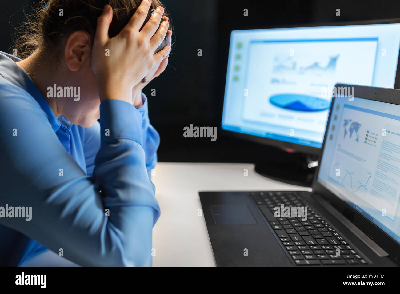 businesswoman with computer at night office Stock Photo - Alamy