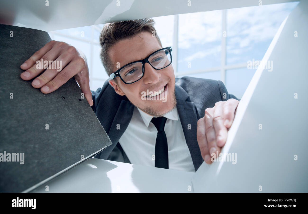 man looks at the folder with documents Stock Photo - Alamy