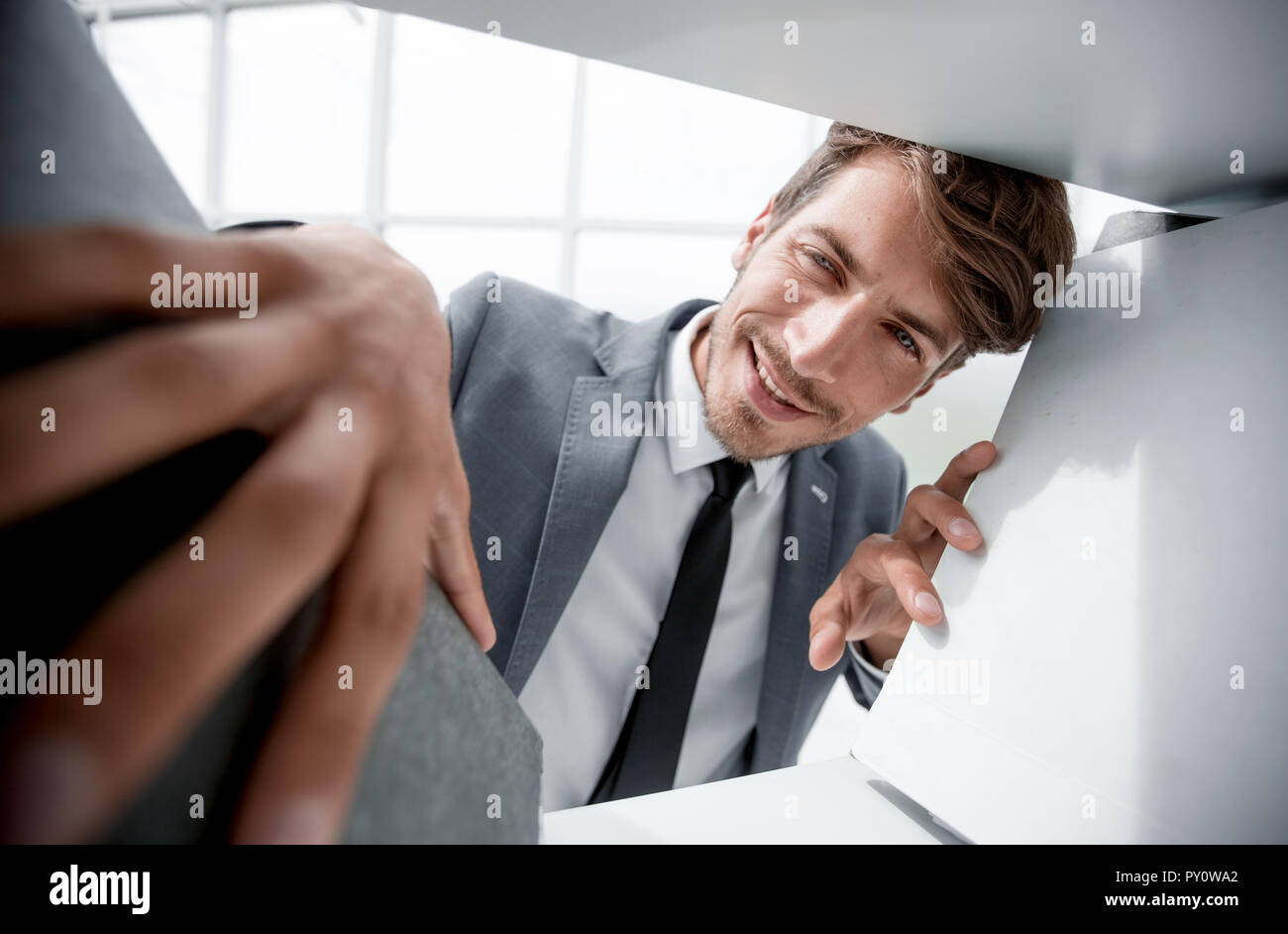 young man takes his hands folder Stock Photo - Alamy
