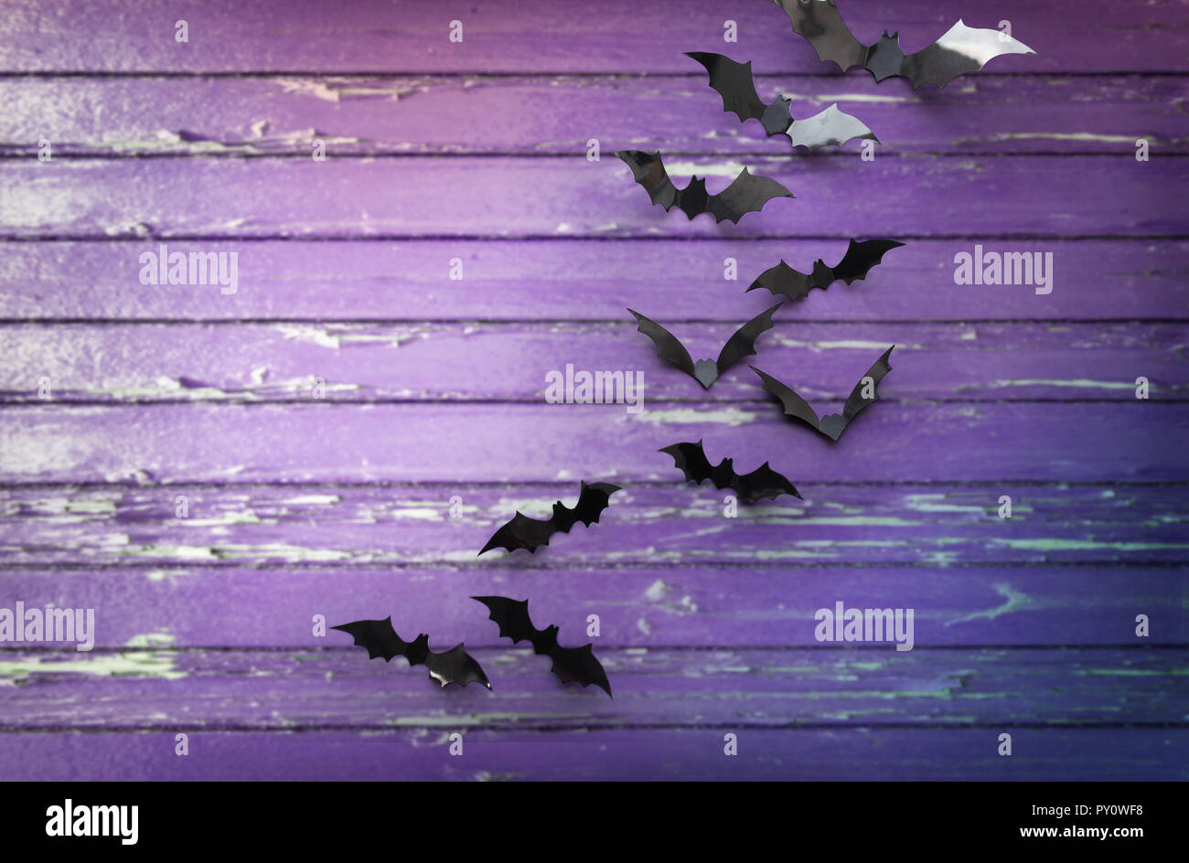 black bats over ultra violet shabby boards Stock Photo - Alamy