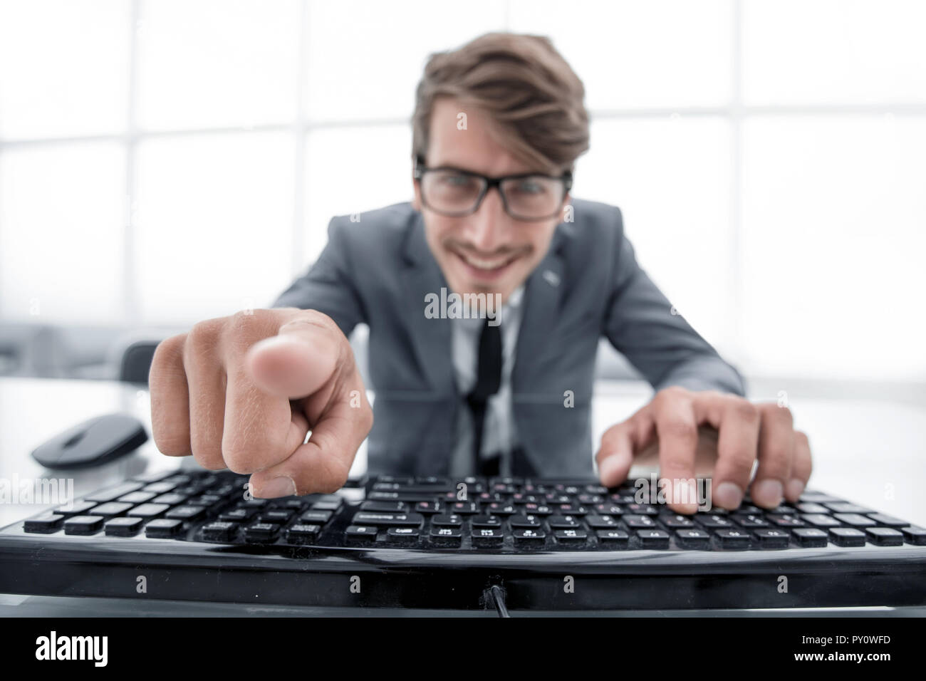 man pointing at something with finger and using computer keyboar Stock ...