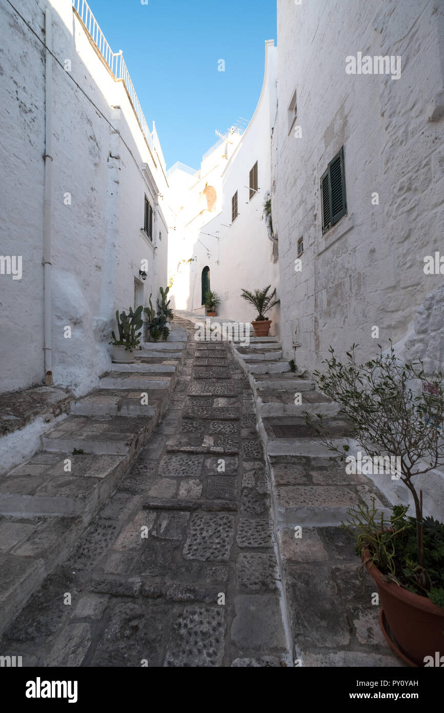 Ostuni Italy. White washed buildings on a stepped street in Ostuni in ...