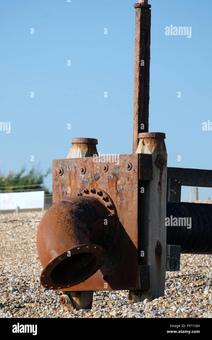 Rusty sewage pipe outlet on beach at East Preston, West Sussex, UK ...