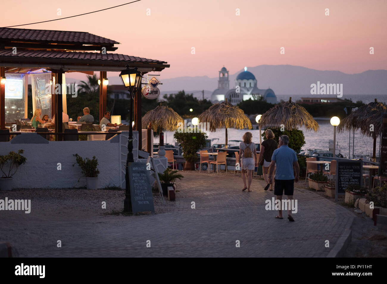 © Guy Newman. The bars and restaurants around the Port of Skala on the ...