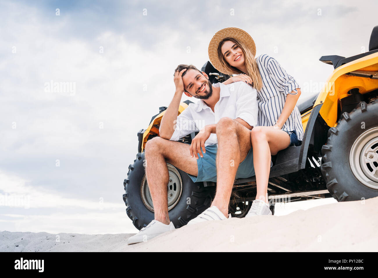 Young couple sitting on quad hi-res stock photography and images - Alamy