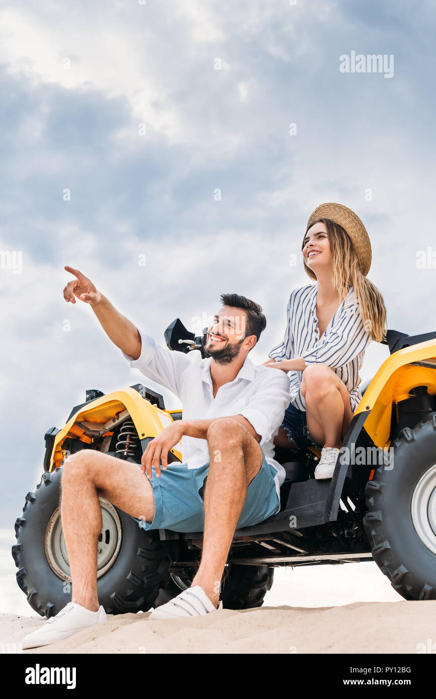 Young couple sitting on quad hi-res stock photography and images - Alamy