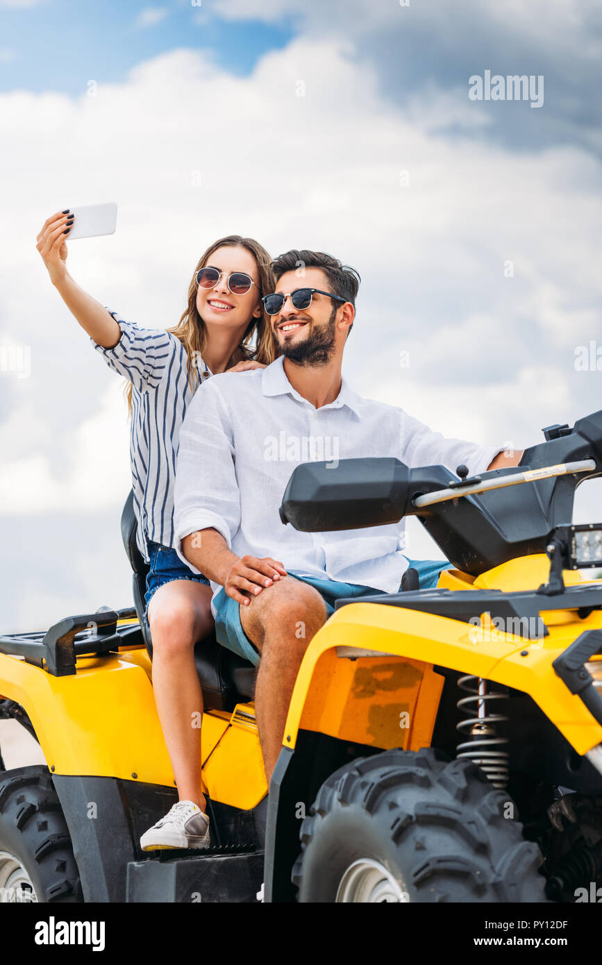 Young couple sitting on quad hi-res stock photography and images - Alamy