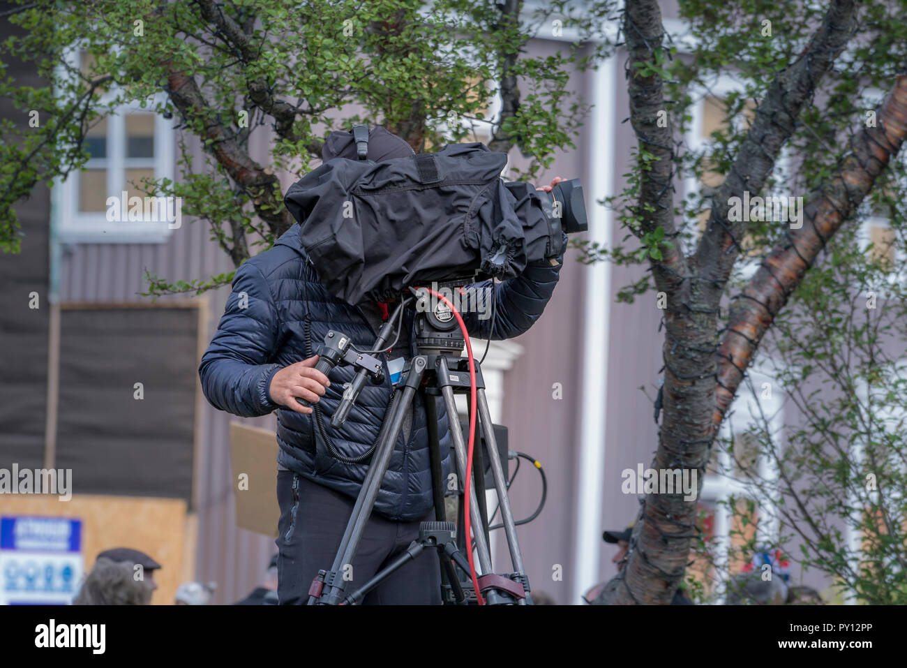 Camera man filming festivites during the Icelandic independence day ...