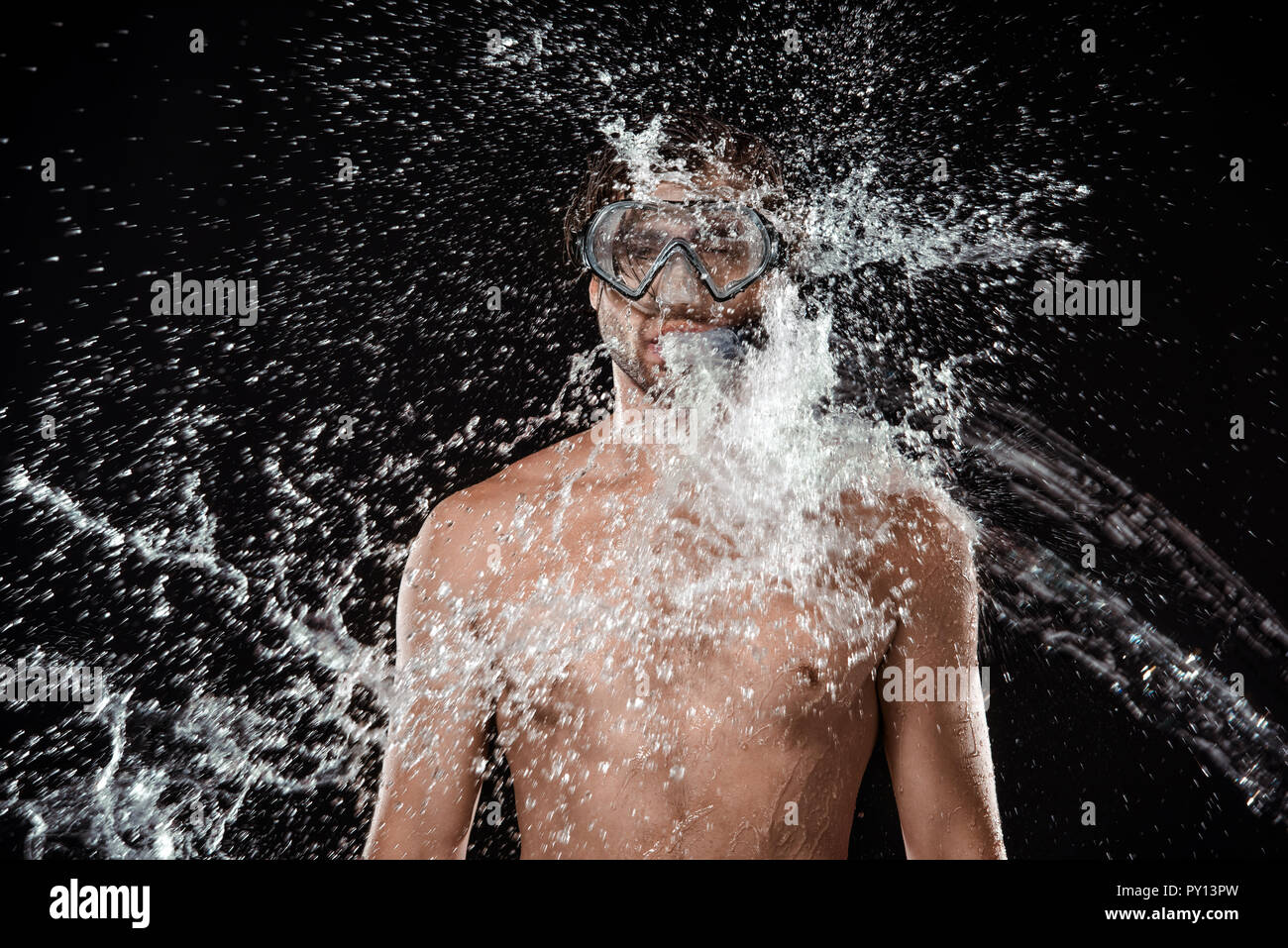 portrait of shirtless man in swimming mask with snorkel swilled with ...