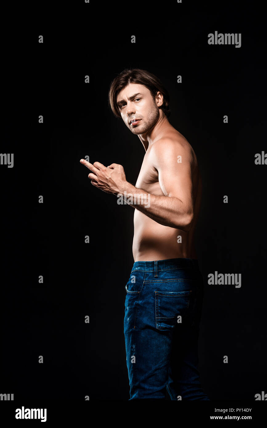 shirtless man in jeans showing middle finger to camera isolated on ...