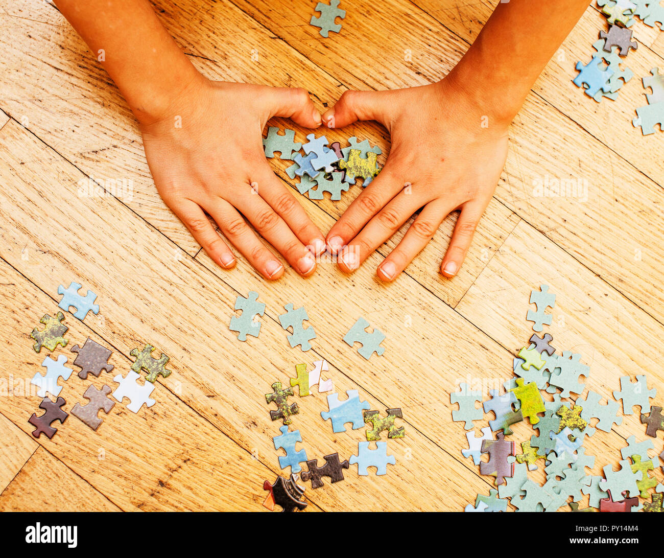 Children playing together jigsaw puzzle hi-res stock photography and ...