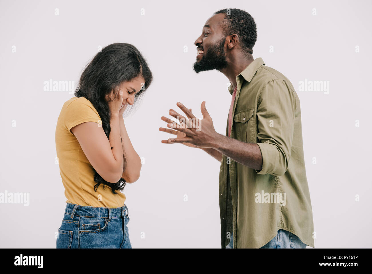 side view of african american boyfriend screaming at girlfriend ...