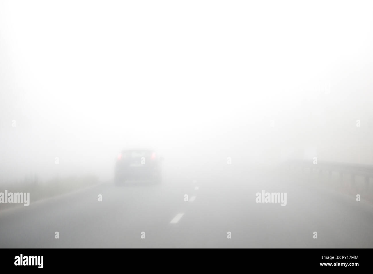 Car driving slowly street hi-res stock photography and images - Alamy