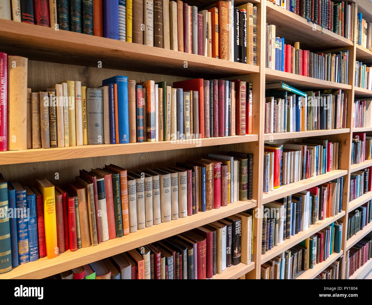 Image of wooden book shelf with books in library Stock Photo - Alamy