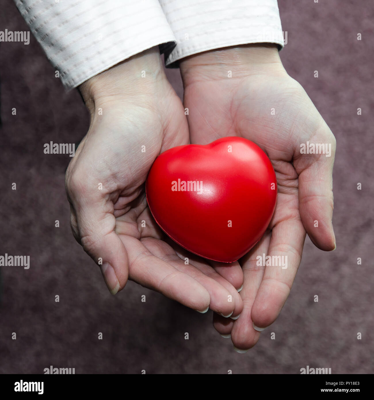 red heart in hands image Stock Photo - Alamy