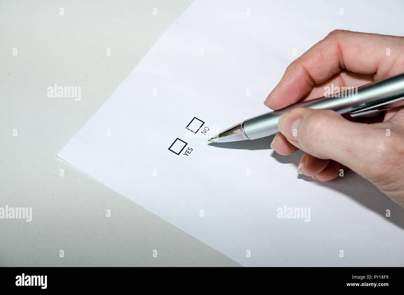 hand with pen filling in a questionnaire Stock Photo - Alamy