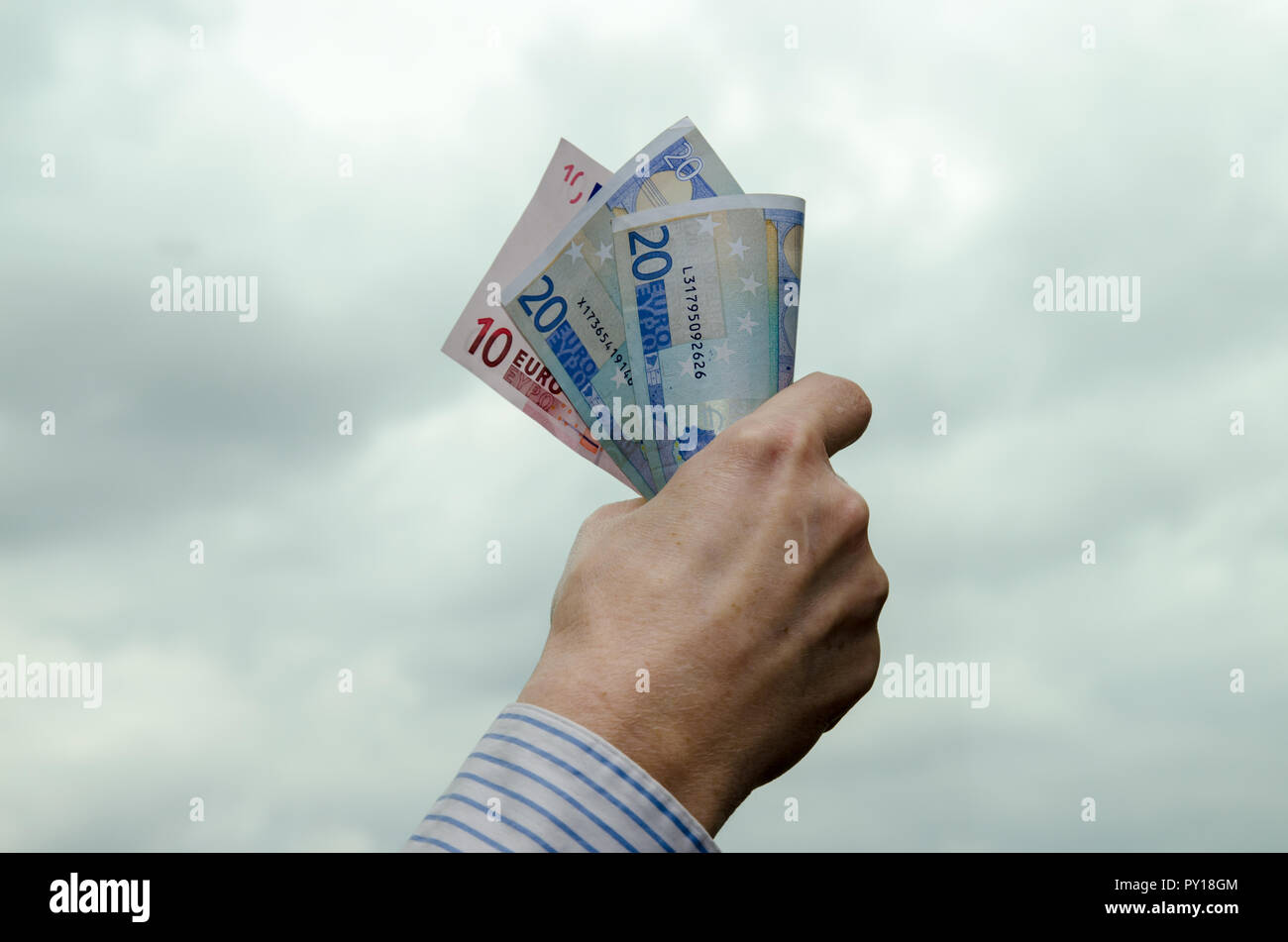 Anonymous money hi-res stock photography and images - Alamy